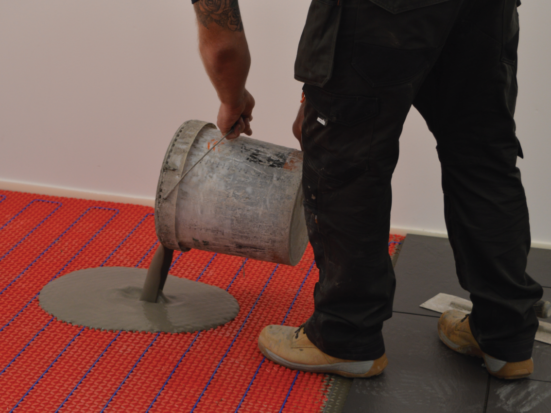 How much self-leveler goes over the membrane? | Warmup Canada